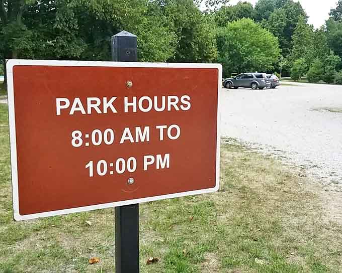 The park's hours posted clearly &ndash; because even paradise has to have some rules about when to come and go.