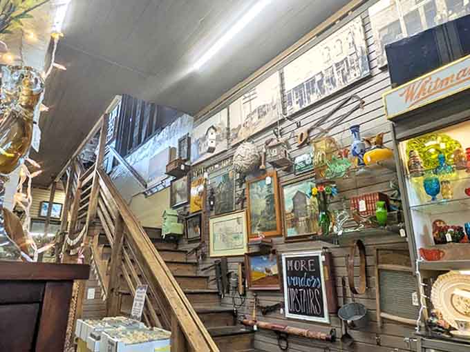 "More wonders upstairs" promises the sign, as the wooden staircase beckons treasure hunters deeper into this multi-level wonderland of collectibles.