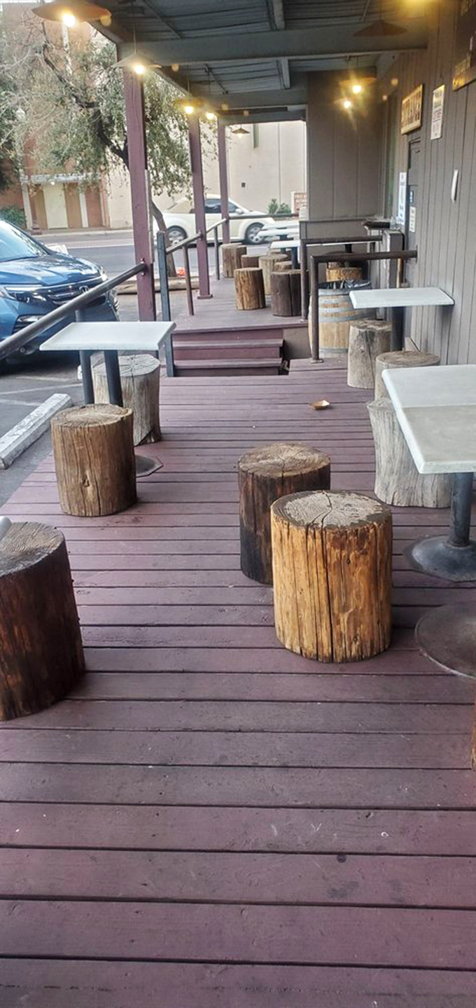 Outdoor seating with rustic Arizona charm. Those tree stump seats aren't trying to be quirky, they're just perfectly suited to the laid-back vibe.