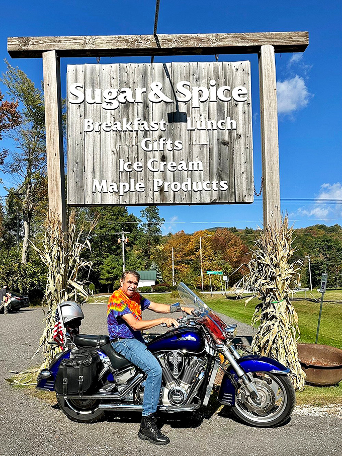 The iconic Sugar & Spice sign stands tall against Vermont's blue sky, a beacon of breakfast hope for hungry travelers.