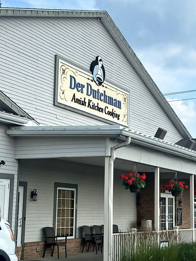 The restaurant's entrance, where hanging flower baskets add a touch of color &ndash; like nature's way of saying "good food inside!"