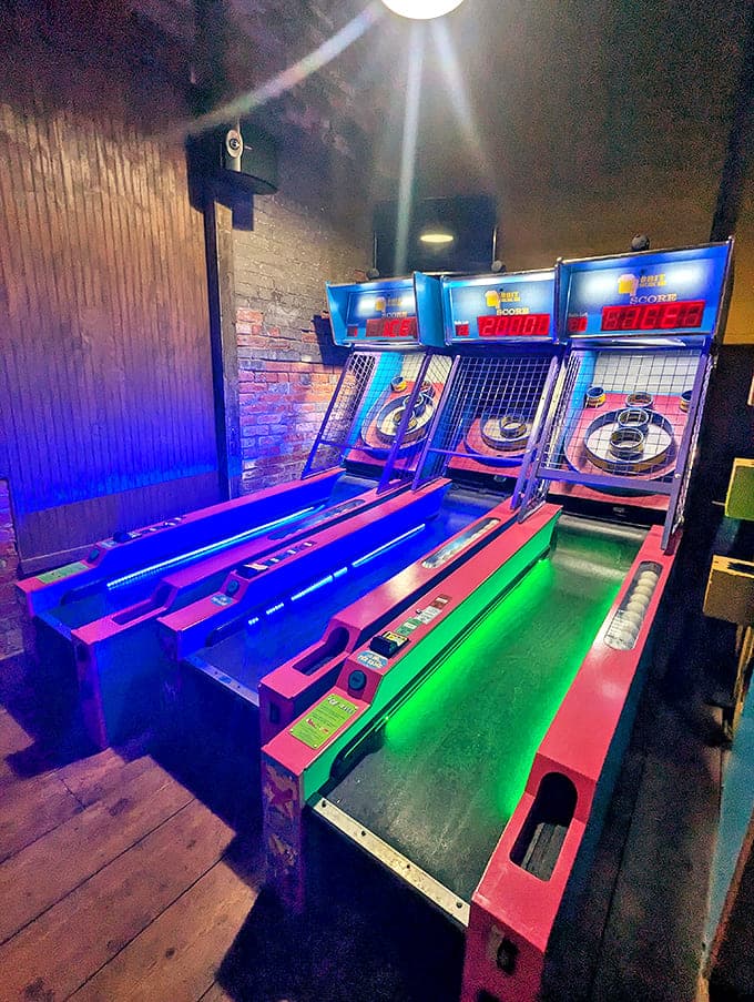 Skee-ball lanes glow with neon promise, inviting players to prove their superior wrist-rolling technique once and for all.