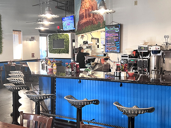 Behind the blue counter, kitchen magicians transform simple ingredients into the breakfast creations that have put Miley's on the culinary map.