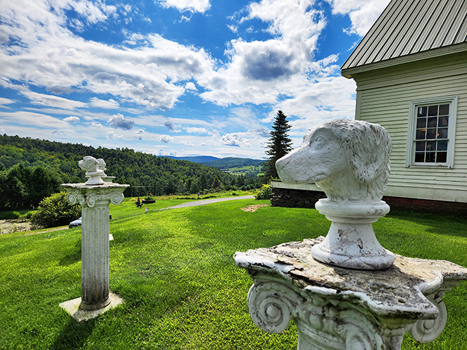 Regal dog sculptures perched on classical columns survey the Vermont landscape, guardians of this special place where canines are celebrated as royalty.