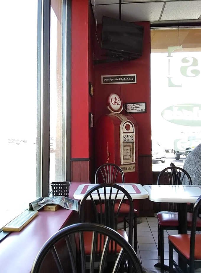 The cozy seating area invites you to sit and savor rather than rush through your meal. Those red chairs have supported countless happy diners over the years.