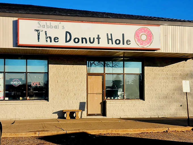 Morning sunshine illuminates the storefront, beckoning early risers to start their day with something sweet and special.