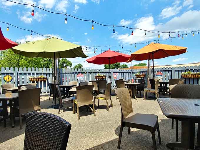 Colorful umbrellas and string lights transform the outdoor space into a festive escape from everyday routine.