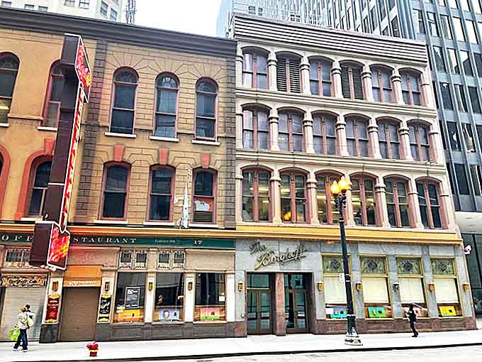 The historic facade stands proud among modern buildings, a testament to quality that never goes out of style.