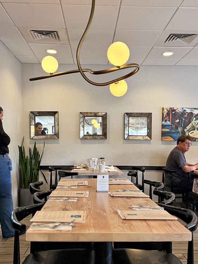 Modern fixtures and warm touches create a space that feels both current and comfortable.