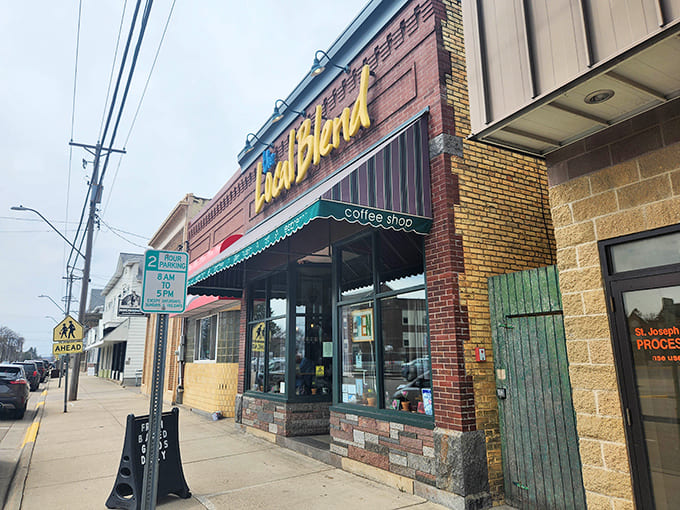 That brick facade and cheerful signage have become a beloved landmark, the kind of place people give directions by: "Turn left at The Local Blend."