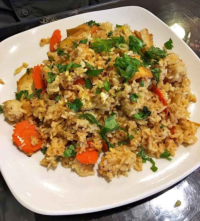 Fried rice that respects each grain's individuality while bringing the whole party together. No soggy, soy-drenched disappointment here &ndash; just wok-kissed perfection.