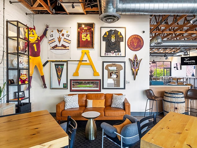 A gallery wall of collegiate pride where mascots and memorabilia create a backdrop for serious eating and drinking decisions.