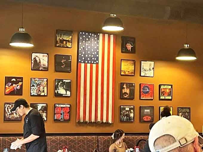 Music history meets breakfast heaven with album covers and American pride creating the perfect backdrop for morning conversations.