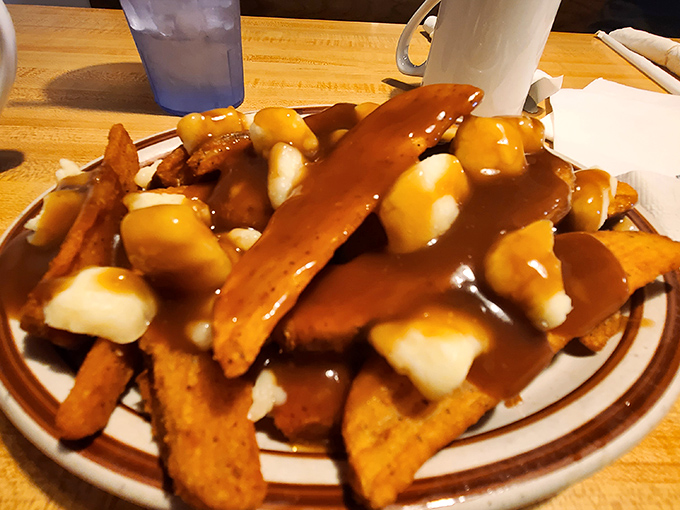 Poutine fries that would make Quebec proud &ndash; crispy potatoes, squeaky cheese curds, and gravy forming a holy trinity of indulgence.