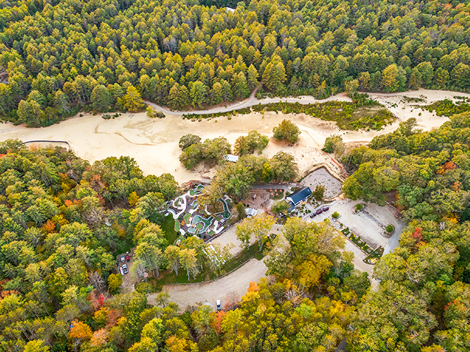An aerial view reveals the Desert of Maine's true wonder &ndash; a golden patch of sand surrounded by Maine's signature green forests.