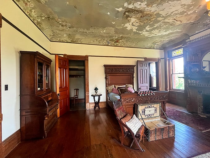 The bedroom setup suggests that Victorian comfort involved a lot more carved wood and a lot less memory foam than modern sleeping arrangements.