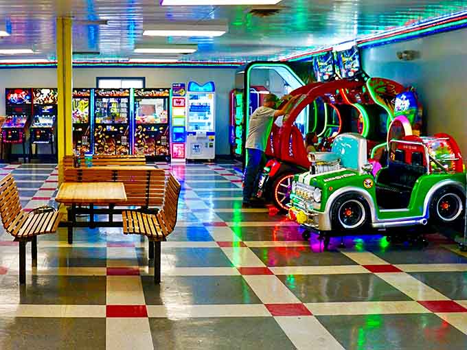 The arcade offers electronic entertainment that bridges generational gaps, where parents' nostalgia meets kids' enthusiasm in a neon-lit time capsule.