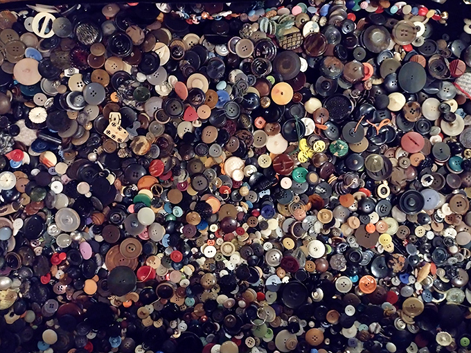 Thousands of buttons create a mesmerizing mosaic of color and texture, elevating these humble fasteners to art through sheer accumulation.