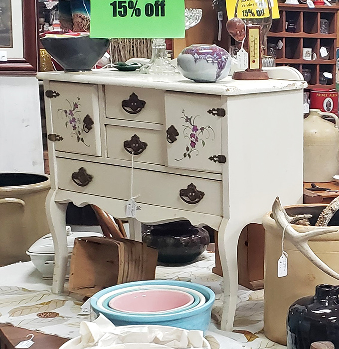 This painted dresser with delicate floral details represents the kind of one-of-a-kind furniture find that makes Crazy Frank's a decorator's paradise.