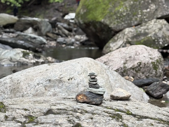 Stone upon stone &ndash; these carefully balanced cairns mark the path of previous explorers seeking waterfall bliss.