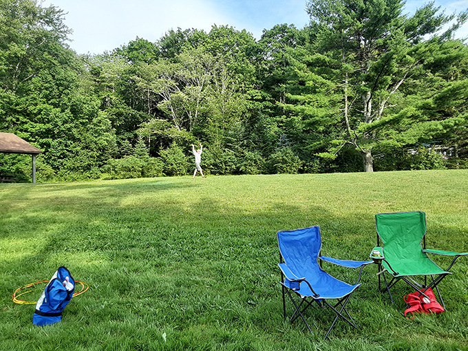 Empty chairs waiting patiently for their occupants to return from adventures on the water or in the woods.