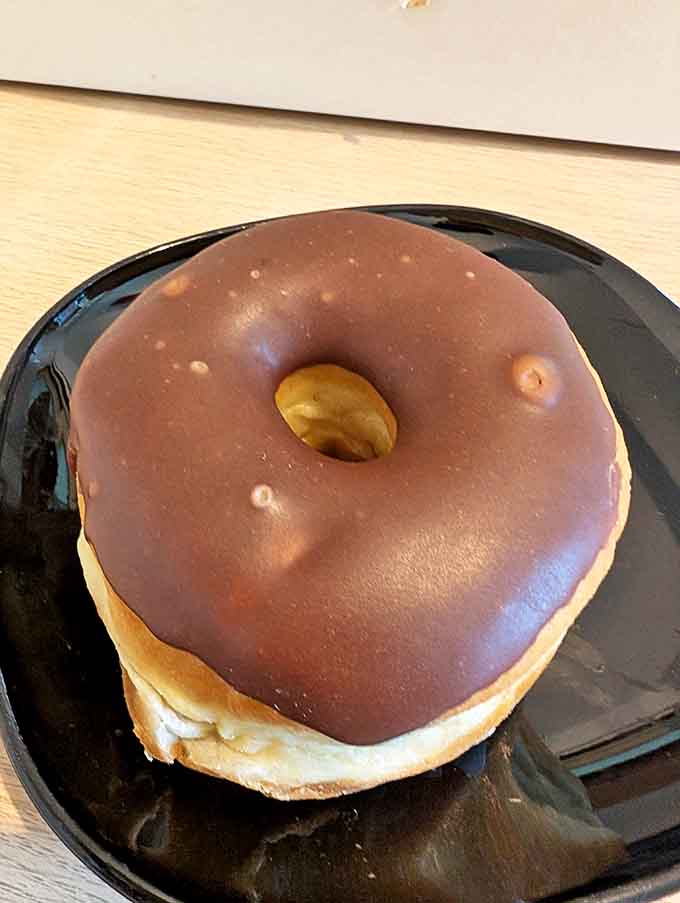The chocolate glazed donut in all its simple perfection &ndash; proof that sometimes the classics endure because they've already achieved donut nirvana.