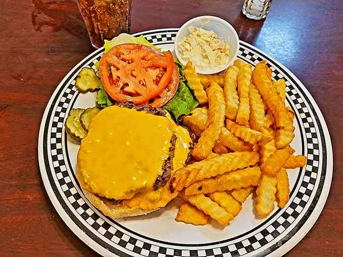 The classic cheeseburger and fries &ndash; proof that perfection doesn't require reinvention, just quality ingredients and someone who cares about cooking them right.