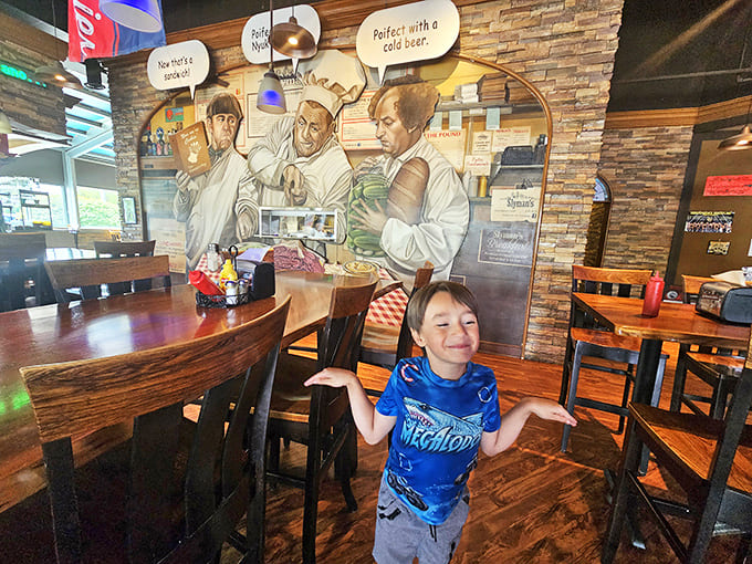 Where strangers become friends over shared food comas. This young diner's expression says it all: "I can't believe this sandwich is real!"