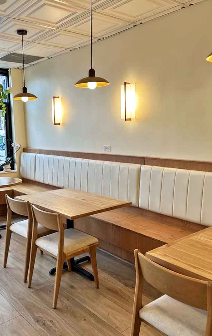 The dining room's classic checkered floor and burgundy chairs create that perfect "everybody knows your name" neighborhood restaurant vibe.
