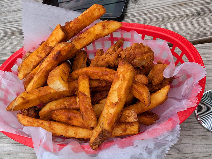 Golden, crispy fries nestled in their basket – a familiar comfort with just enough seasoning to make them dangerously addictive between bites of your main dish.