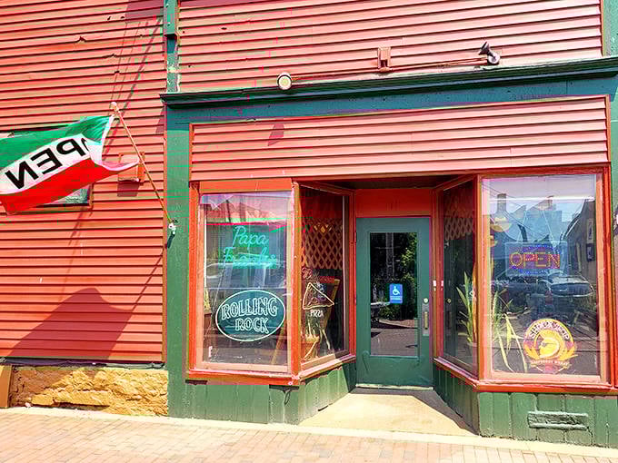 The welcoming entrance with its neon signs promises authentic Italian delights within. Like a portal to a simpler, more delicious dimension.