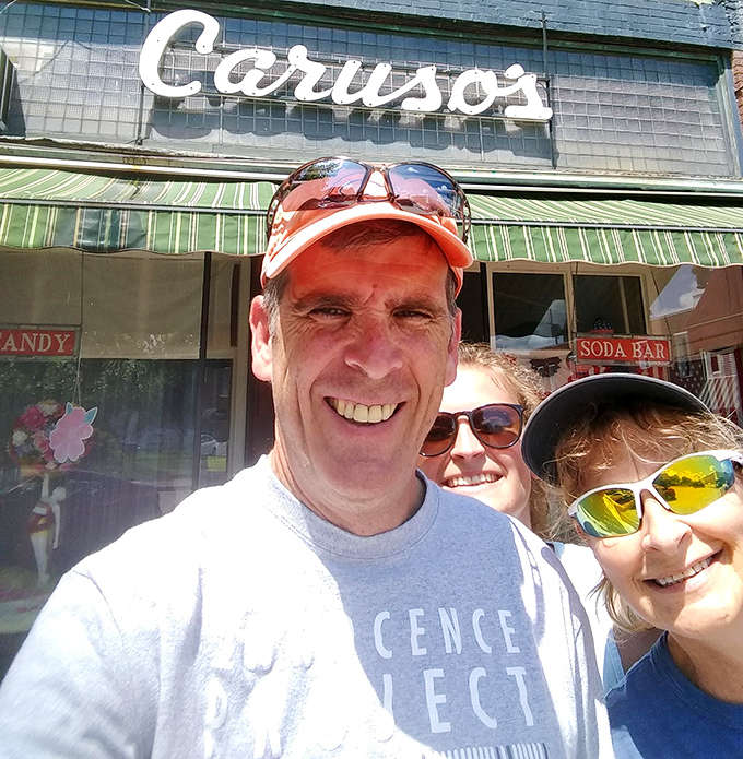 Happy customers outside Caruso's aren't just posing for a photo &ndash; they're documenting the before-and-after of a sweet pilgrimage that's become a family tradition.