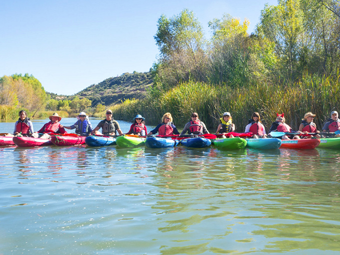 Kayakers line up on the Verde River, one of Arizona's few perennial waterways, ready to spot herons, beavers, and maybe even otters.