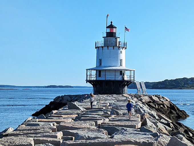 The breakwater path invites adventurous souls to make the journey out to the lighthouse, promising rewarding views with every step.