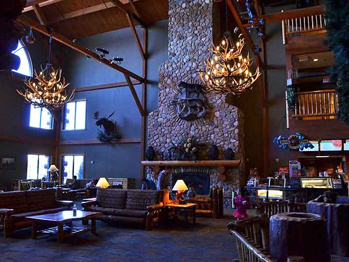 Antler chandeliers cast a warm glow over the rustic-chic lobby where exhausted parents contemplate a second mortgage for just one more day of fun.