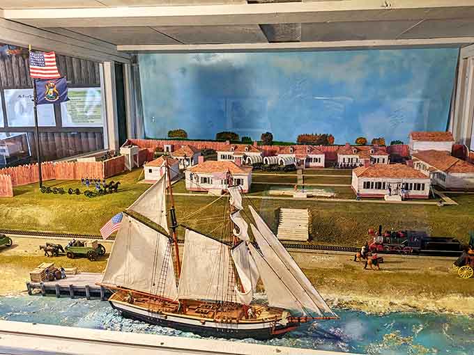 This detailed miniature display recreates Fort Gratiot as it appeared in earlier days, complete with tiny sailing vessels navigating the treacherous channel.