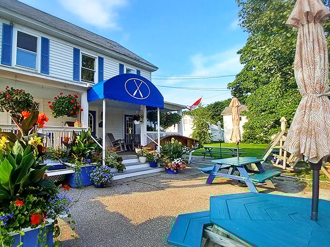Flower boxes bursting with color frame the entrance &ndash; nature's way of saying this place blooms with creativity inside and out.