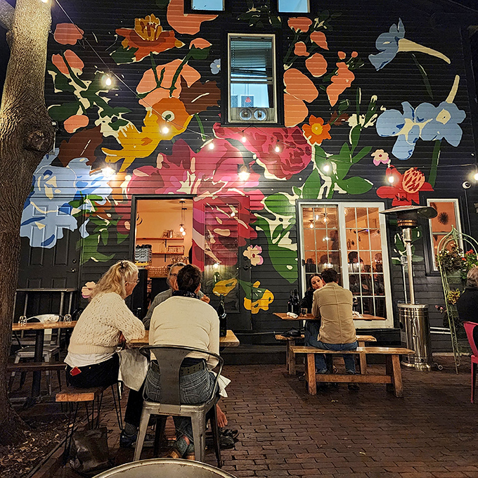 The outdoor patio blooms with colorful flowers, creating a secret garden vibe that makes al fresco dining magical. Portland's best-kept secret for warm weather brunching.