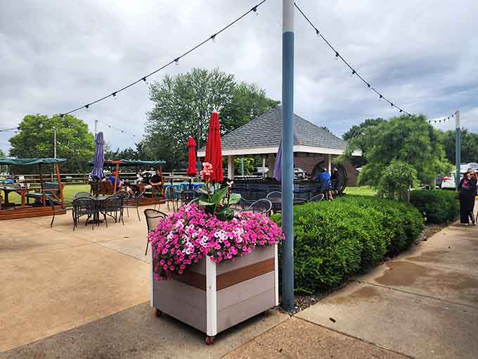 String lights and comfortable seating transform the outdoor area into an evening oasis for waterfront dining.