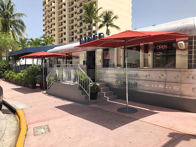 From the street, the diner beckons with retro charm – a stainless steel oasis amid South Beach's Art Deco landscape.