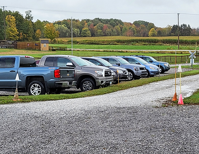 The parking area fills quickly on busy days – each vehicle carrying passengers eager for their miniature railroad journey.