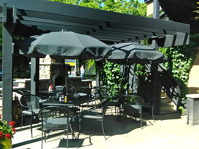 The outdoor patio offers a shaded retreat during Minnesota summers, where fresh air somehow makes everything taste even better.