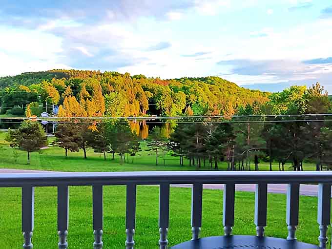 From this vantage point on the porch, Michigan's rolling hills and reflective waters create a living landscape that changes with each passing hour.