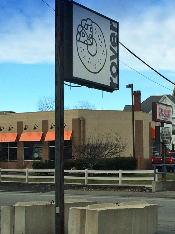 The Rover Bagel sign stands as a beacon of hope for the bagel-deprived, promising wood-fired salvation just steps away.