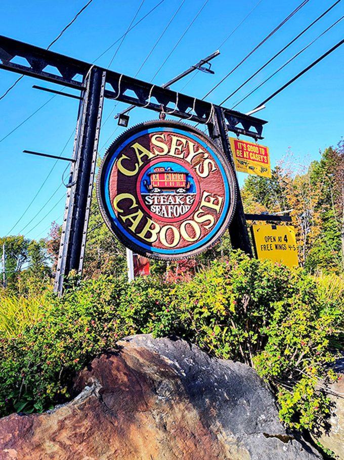 The sign promises steak and seafood, but locals know it's really advertising edible happiness in a train-themed package that delivers every time.