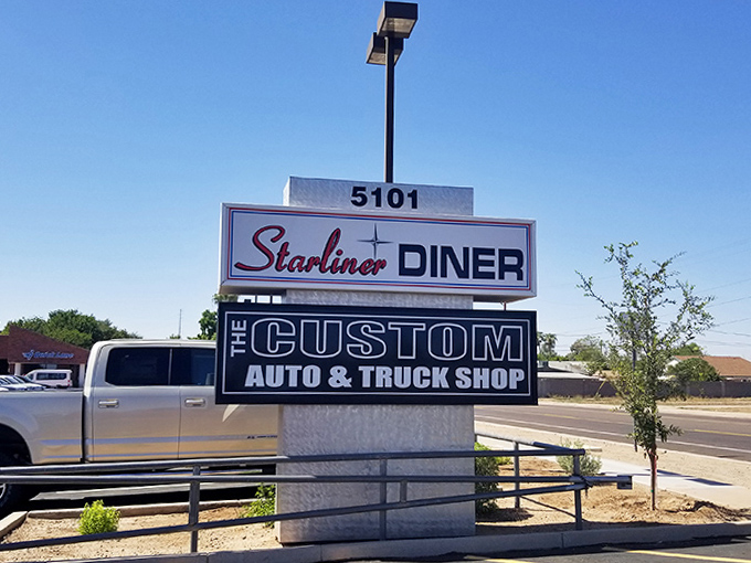 The sign stands as a beacon for hungry travelers, promising refuge from chain restaurants and food that remembers what flavor is supposed to be.