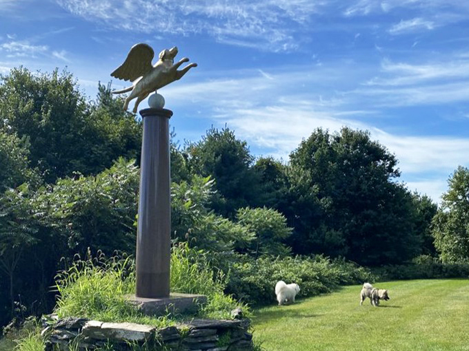 A winged dog takes flight atop a column – the perfect symbol for a place that helps our grief take wing and transforms loss into celebration.