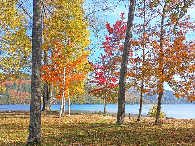 Fall's finest: Crystal Lake's shoreline transformed by autumn colors &ndash; Vermont showing off its seasonal splendor.