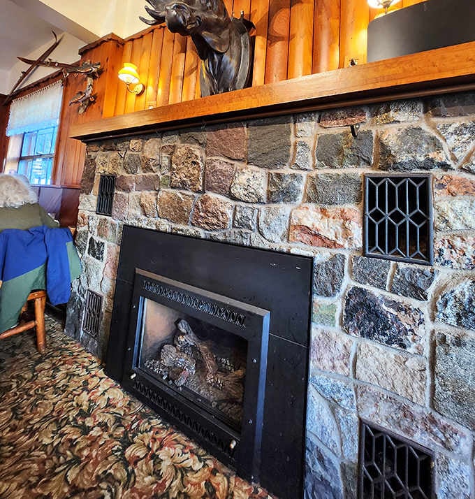 The stone fireplace stands like a silent sentinel, ready to transform cold Michigan evenings into cozy dining experiences worth remembering.