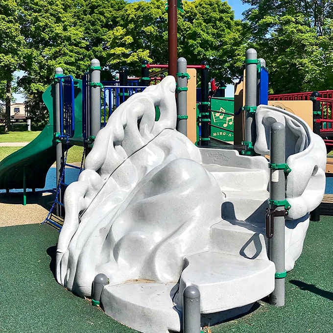 Whoosh! The playground's slides offer thrills for little adventurers while parents enjoy a moment of peace nearby.